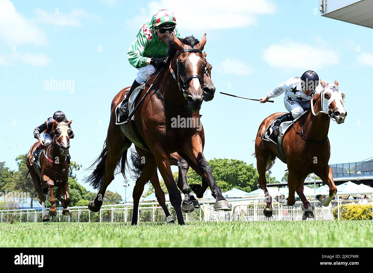 Jockey Larry Cassidy rides First Crush (centre) to victory in Race 2 ...