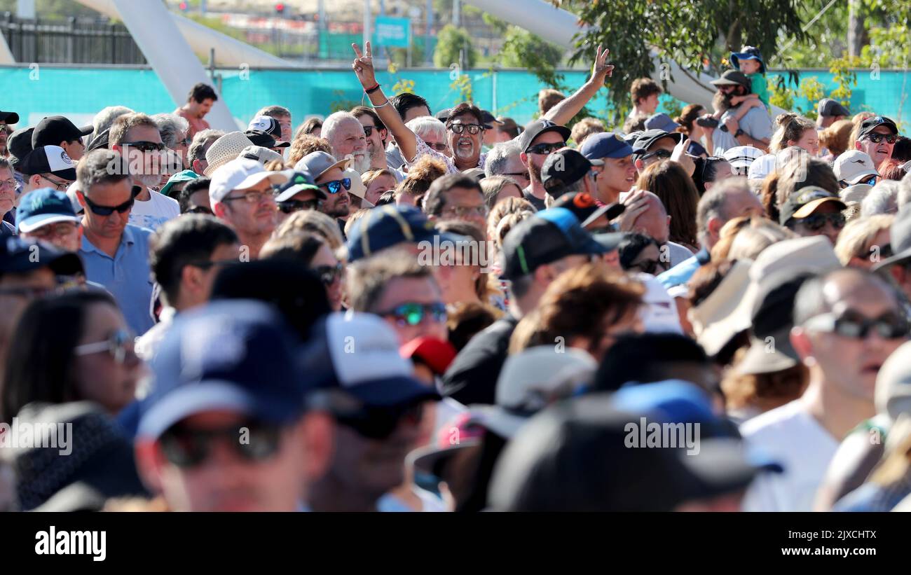Some of the first members of the public wait to enter the new Optus ...
