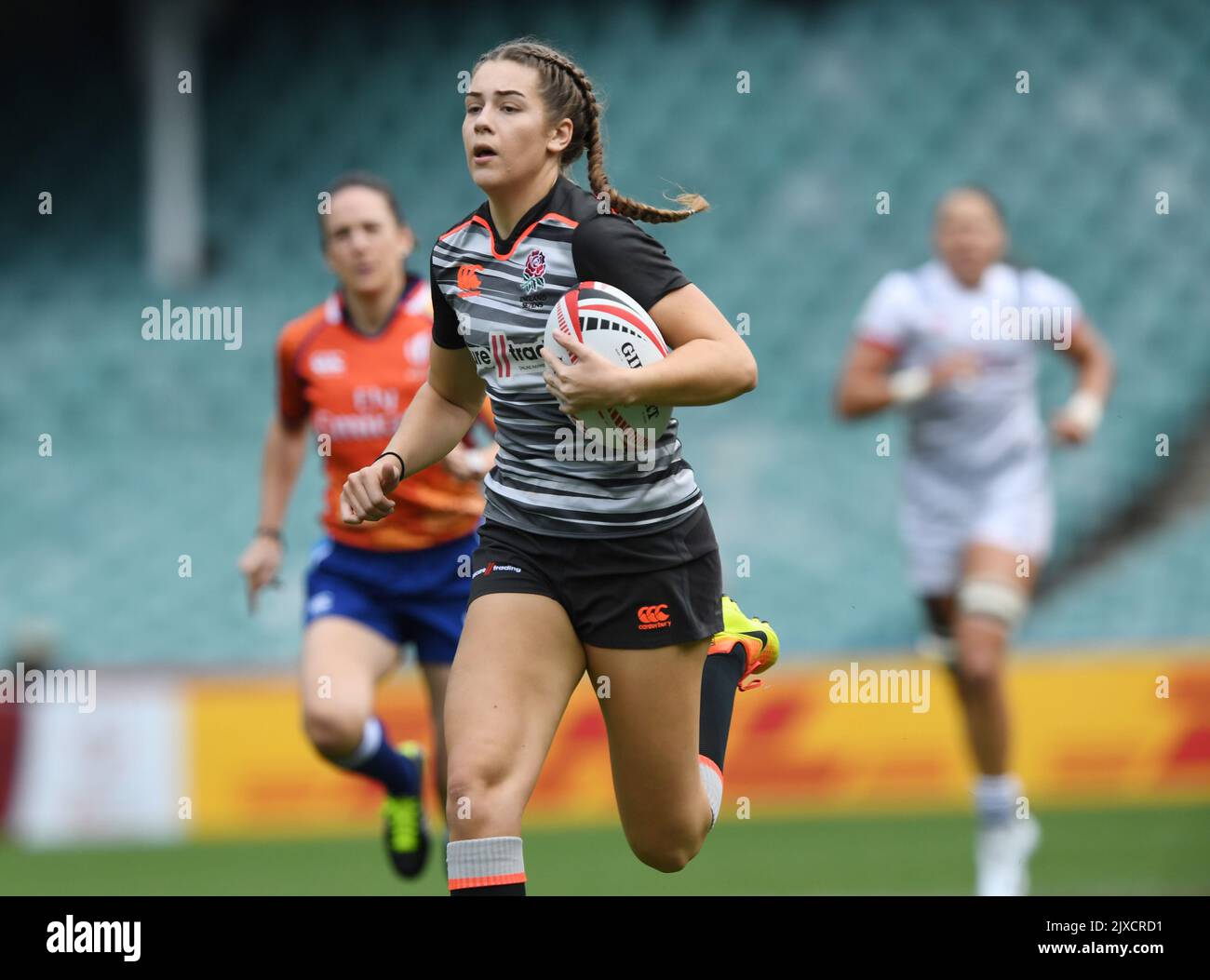 Holly Aitchison of England runs with the ball before scoring try during ...
