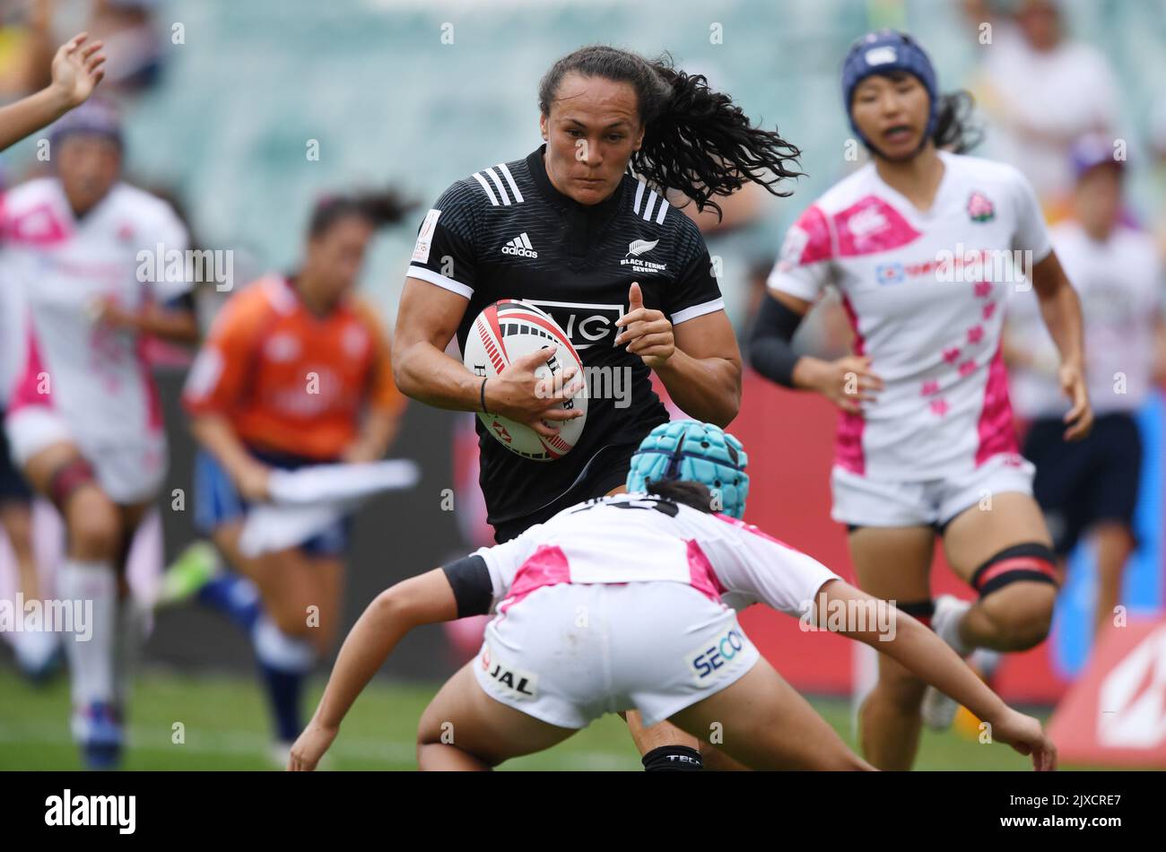 Portia Woodman of New Zealand runs with the ball before scoring try ...
