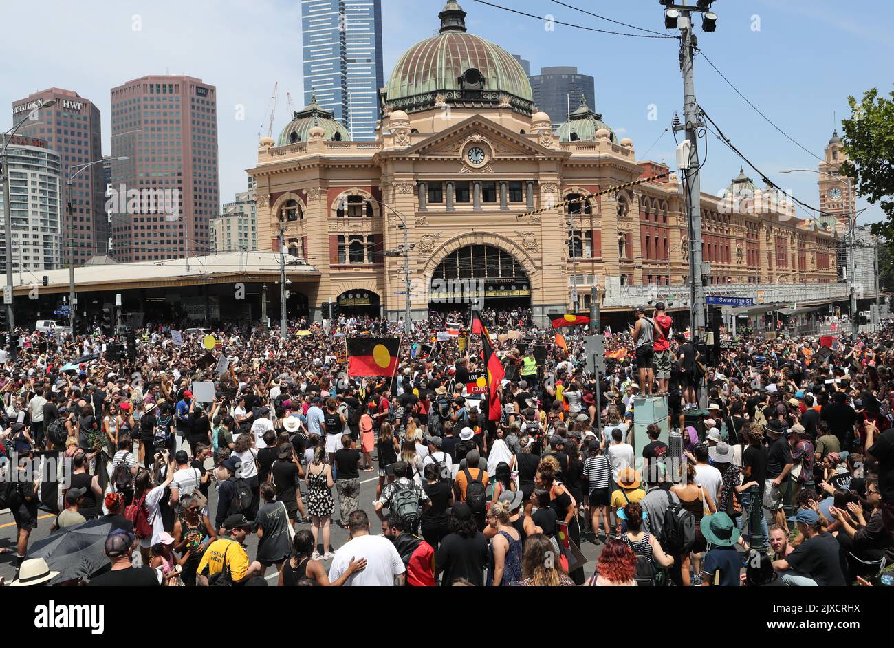 A large crowd of protesters take over the intersection in front of ...