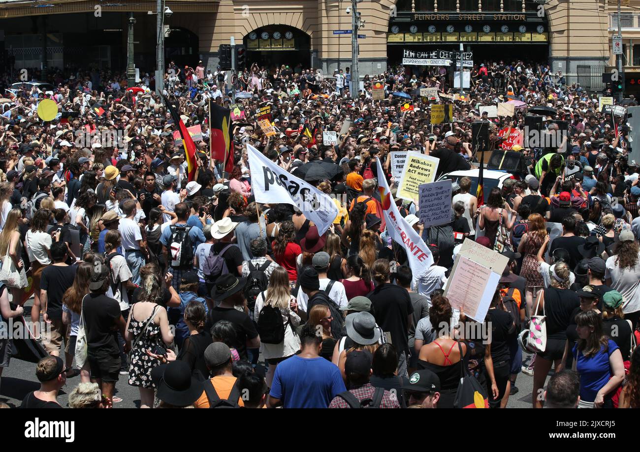 A large crowd of protesters take over the intersection in front of ...