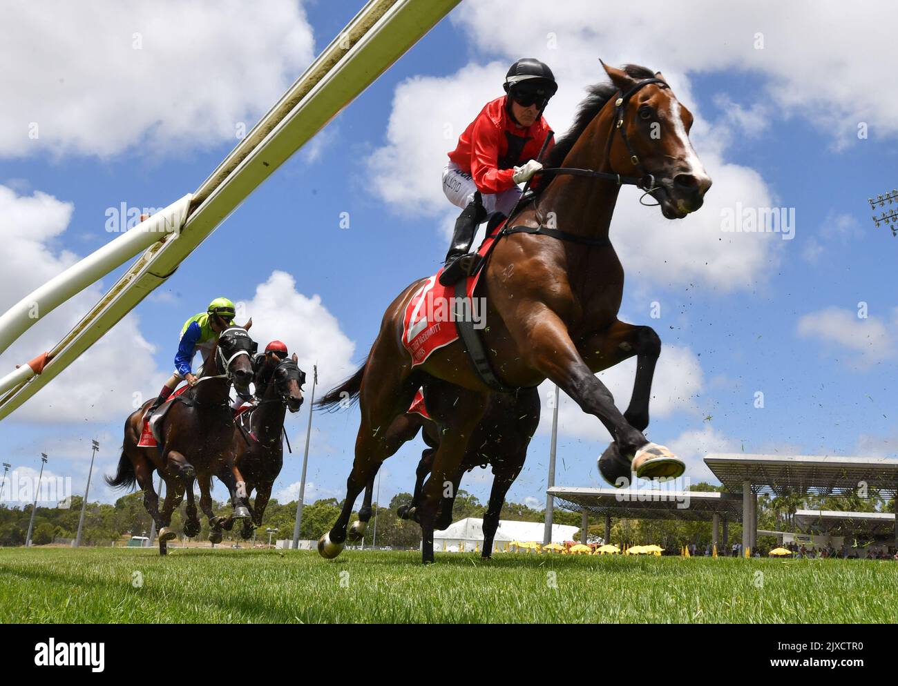 Jockey Jeff Lloyd (right) riding Outraged is seen on the first lap of ...