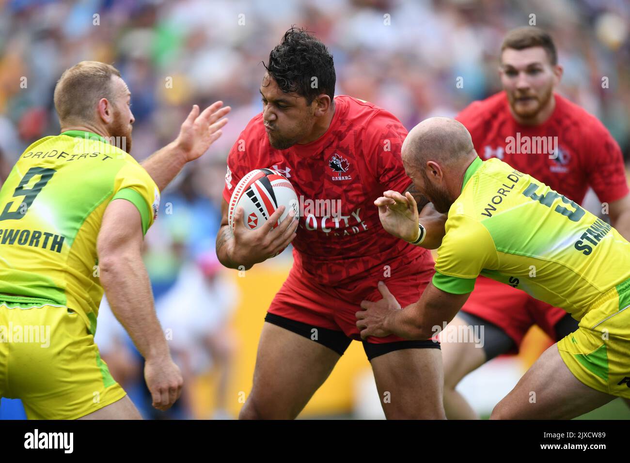 Mike Fuailefau of Canada attempts to run through the Australia defence ...
