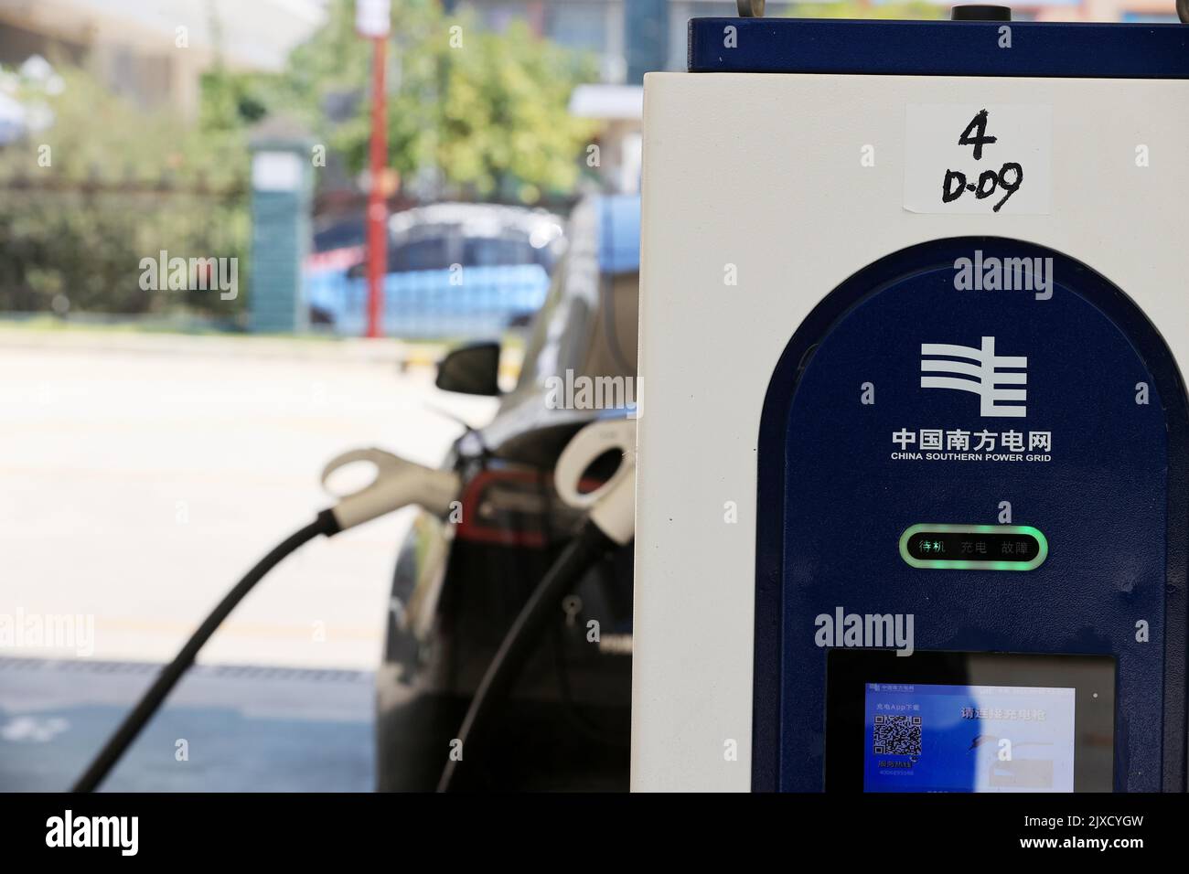 LIUZHOU, CHINA - SEPTEMBER 7, 2022 - An electric vehicle is charged ...