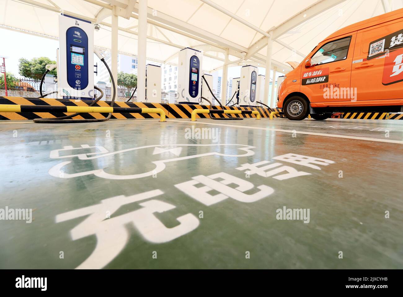 LIUZHOU, CHINA - SEPTEMBER 7, 2022 - An electric vehicle is charged ...