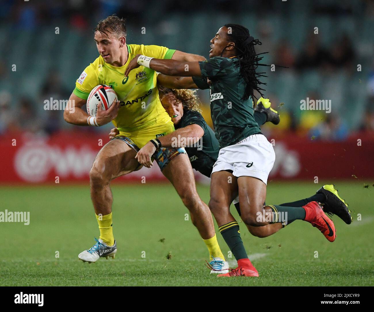 John Porch of Australia runs past the South Africa players during their ...