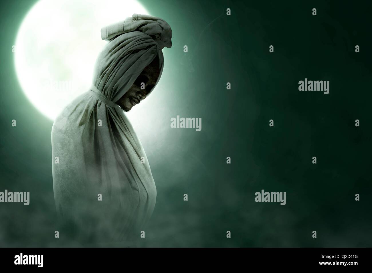 Pocong is covered with a white linen shroud standing with full moon ...