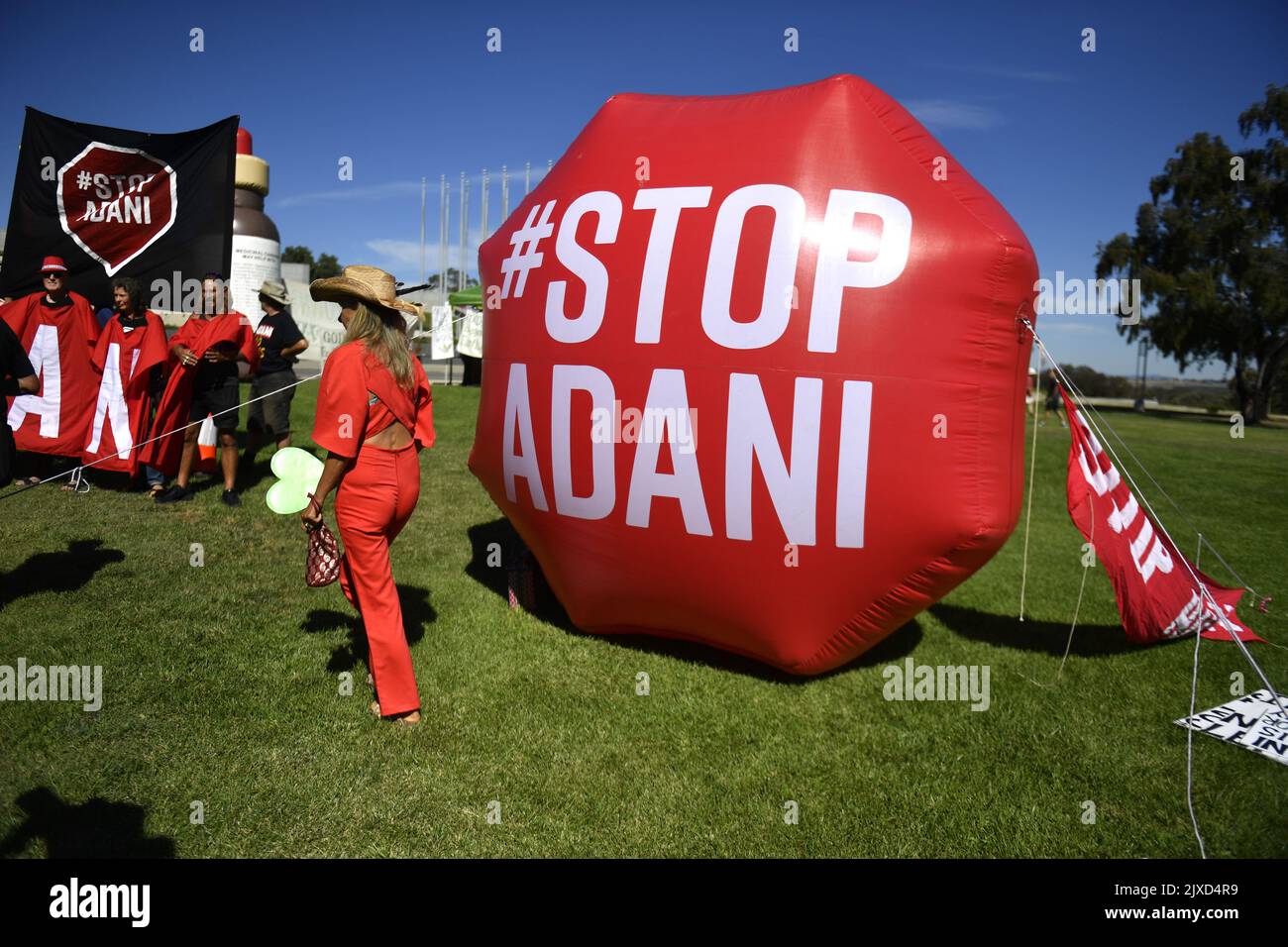 Protesters hold signs and banners at a Stop Adani Mine rally on the ...