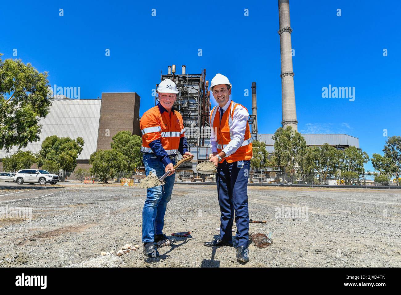 Energy Minister Tom Koutsantonis (right) and AGL CEO Andy Vesey turn ...