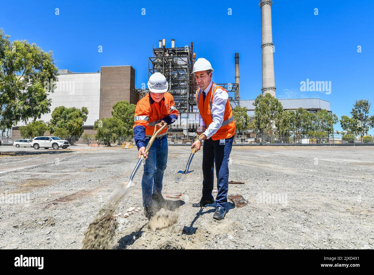 Energy Minister Tom Koutsantonis (right) and AGL CEO Andy Vesey turn ...