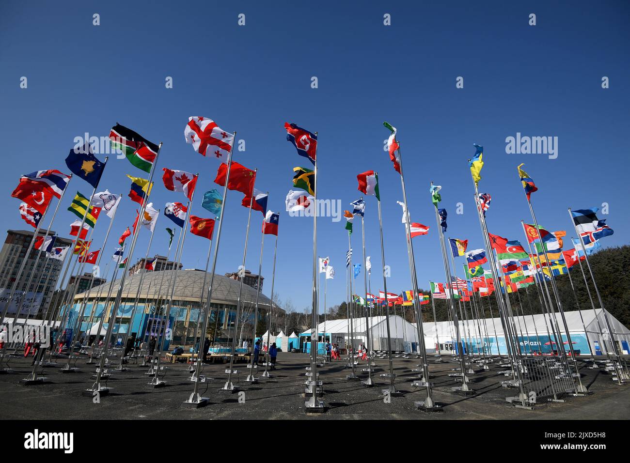 Flags are seen flying at the Athletes Village ahead of the start of the ...