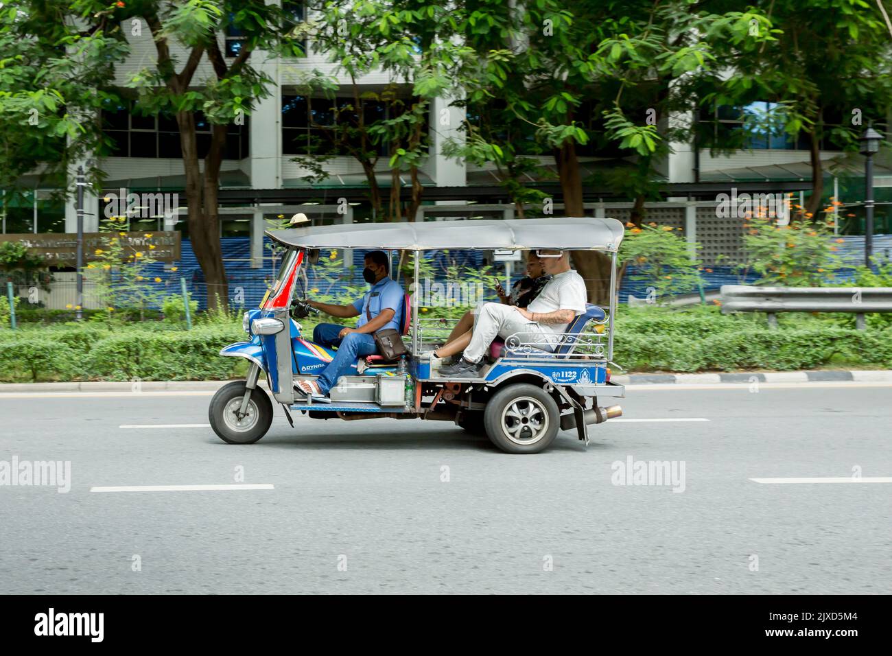 Lumphini, THAILAND - August 26, 2022 : Tricycle (tuk-tuk) running fast ...