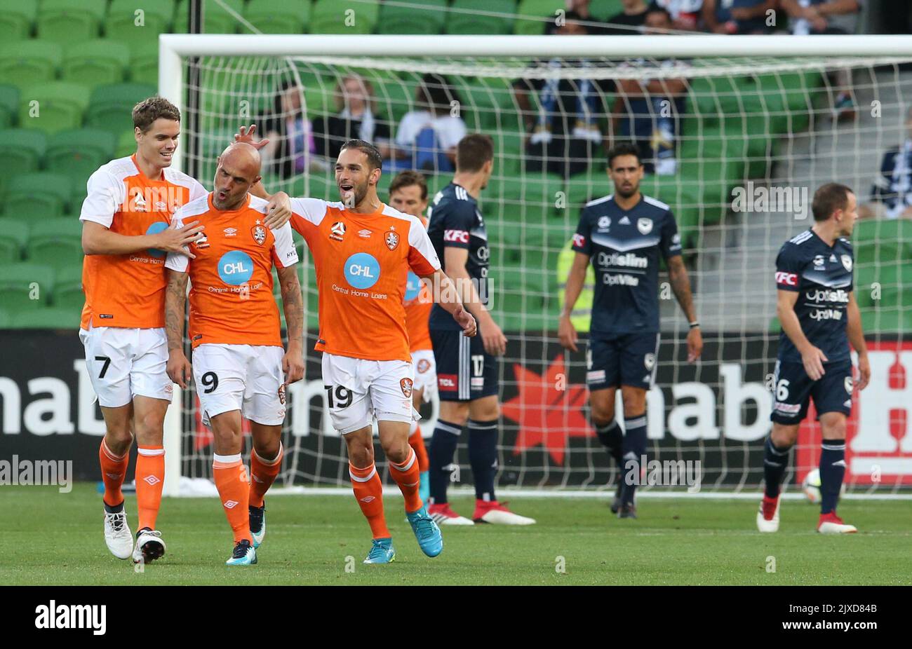 Brisbane Roar celebrate after Massimo Maccarone (2nd left) scores a ...