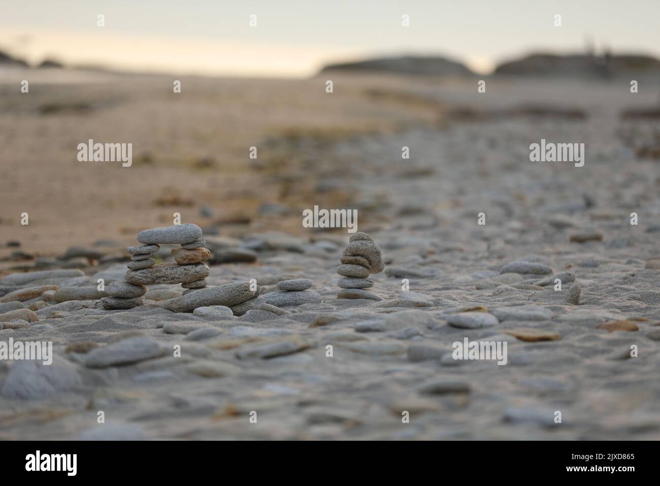 Stone male stones yoga meditation on the beach Stock Photo - Alamy