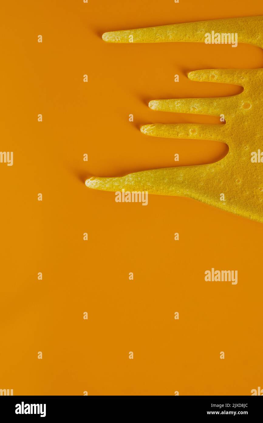 Cream liquid gel serum flowing down on yellow texture Stock Photo - Alamy