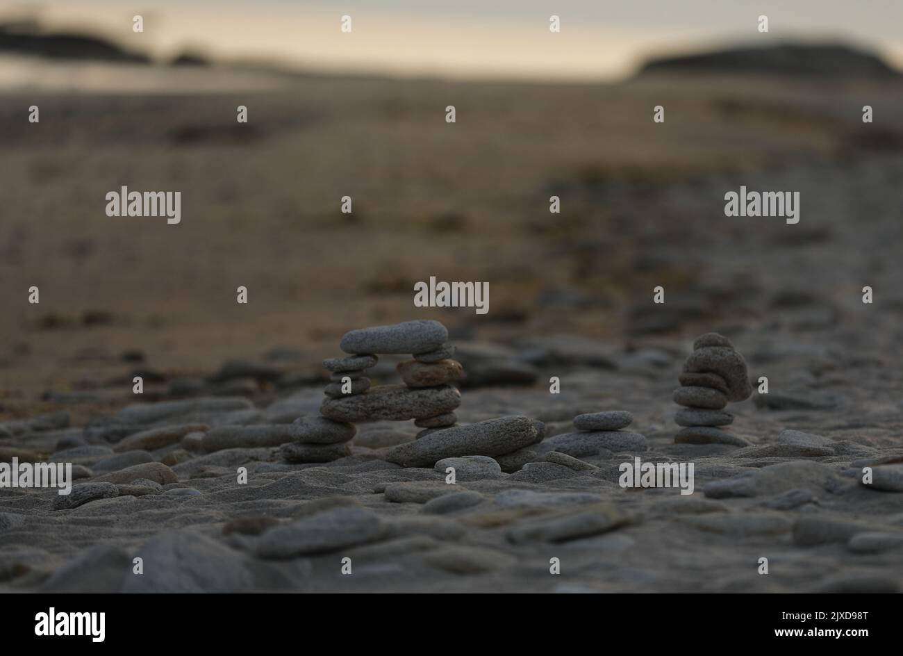Stone male stones yoga meditation on the beach Stock Photo - Alamy