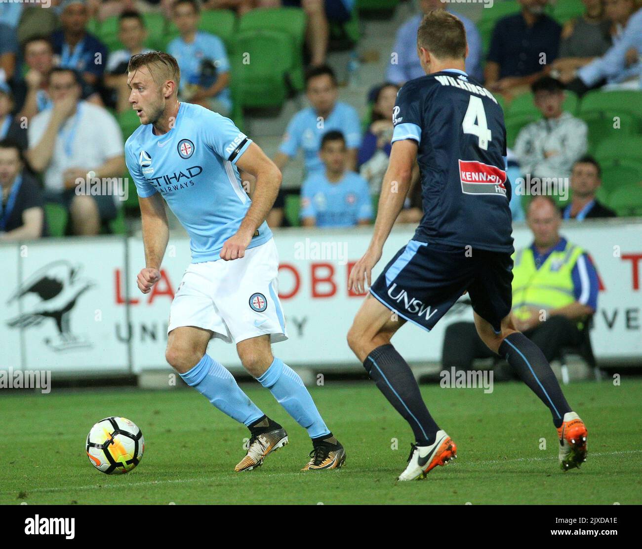 Marcin Budzinski (L) of Melbourne City contests with Alexander ...
