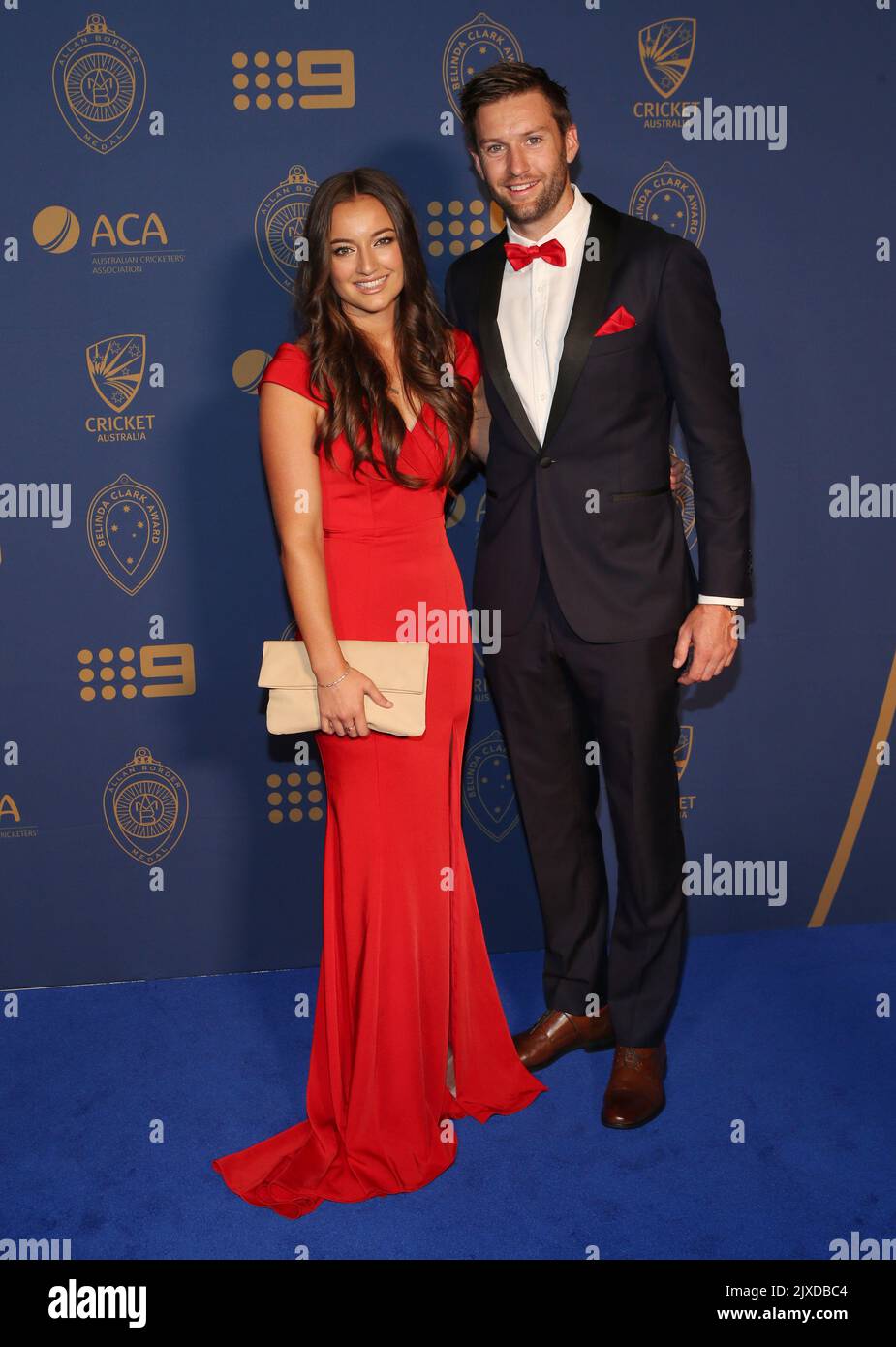 Cricket player Andrew Tye and his partner Bonnie Raynor pose for a ...