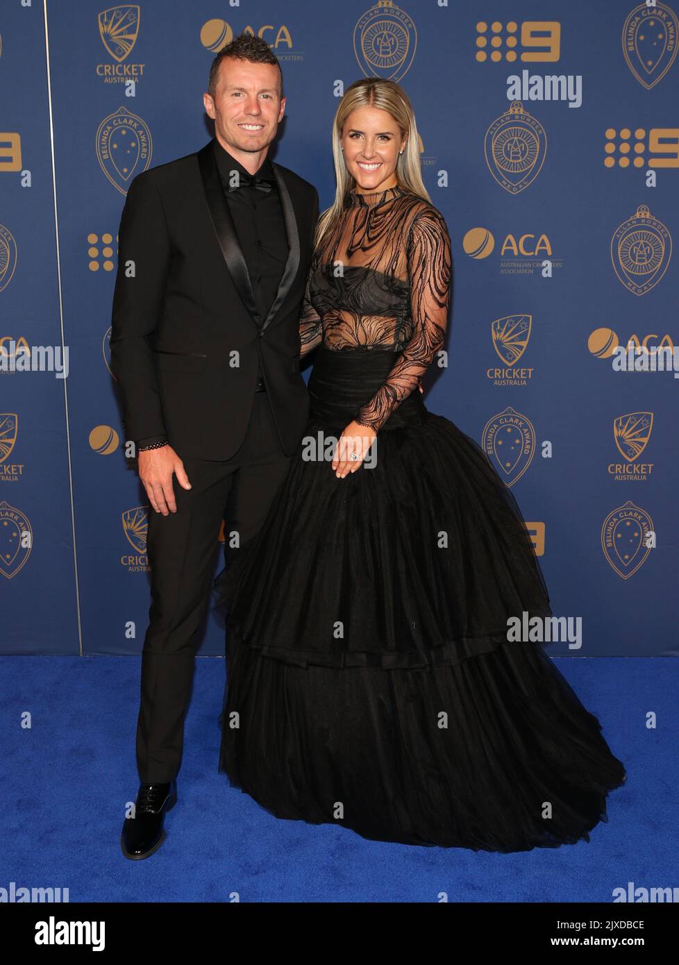 Cricket player Peter Siddle and his partner Anna Weatherlake pose for a ...