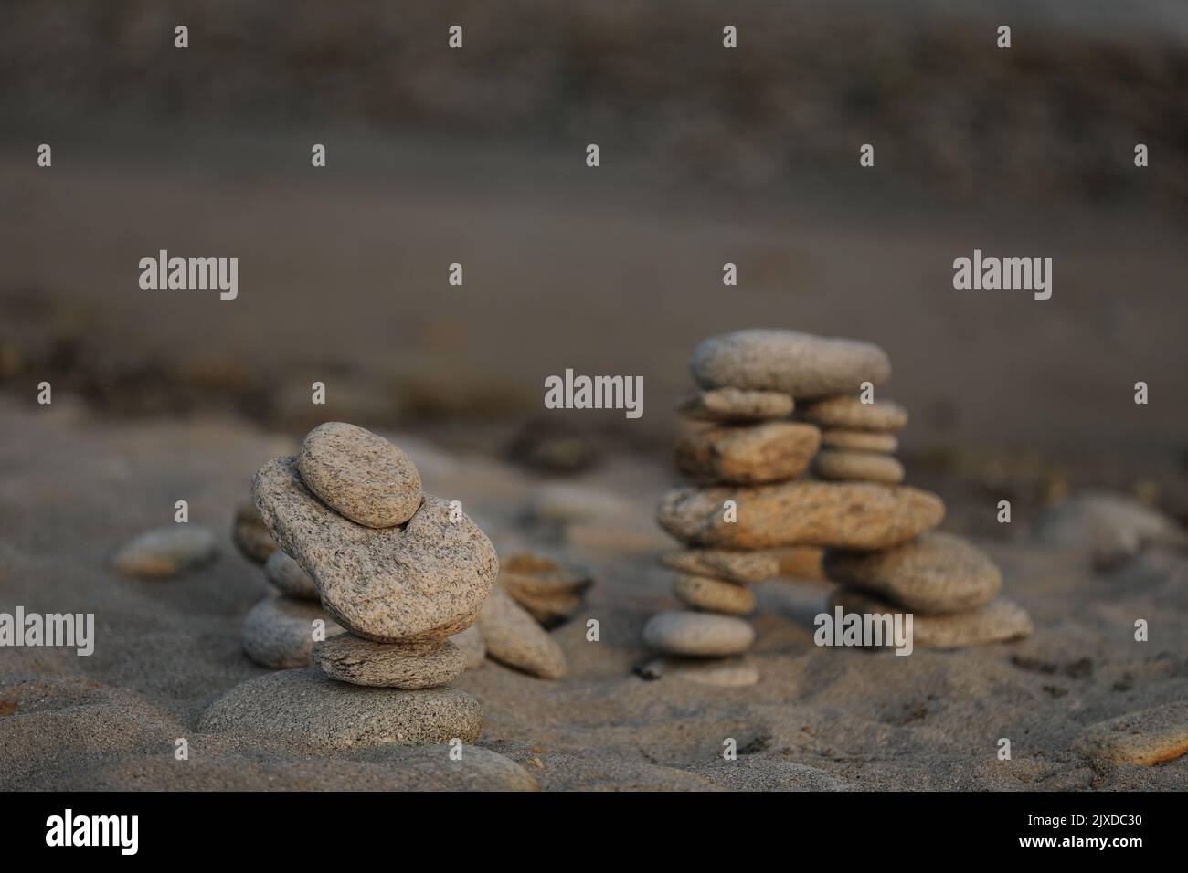 Stone male stones yoga meditation on the beach Stock Photo - Alamy