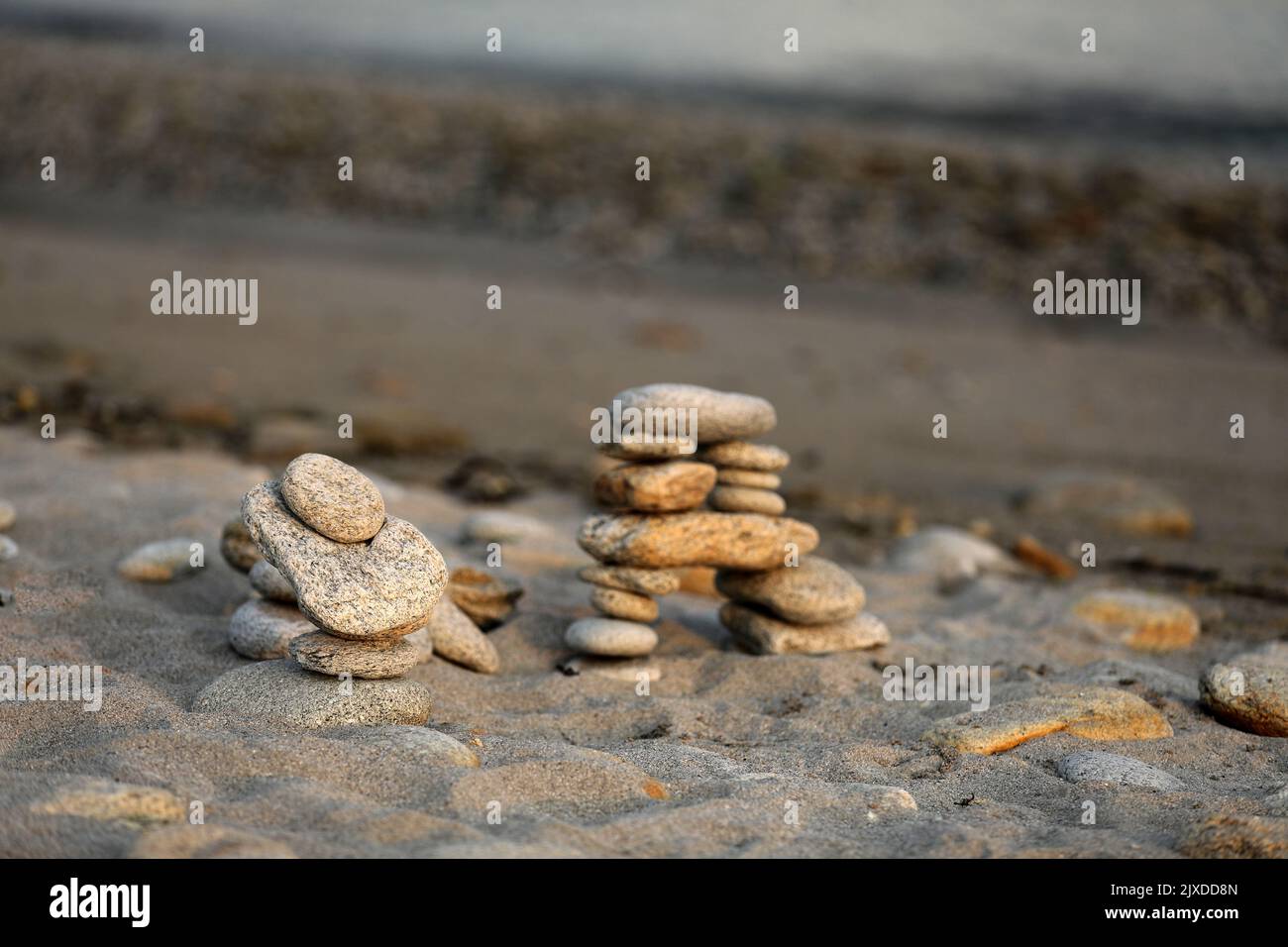 Stone male stones yoga meditation on the beach Stock Photo - Alamy