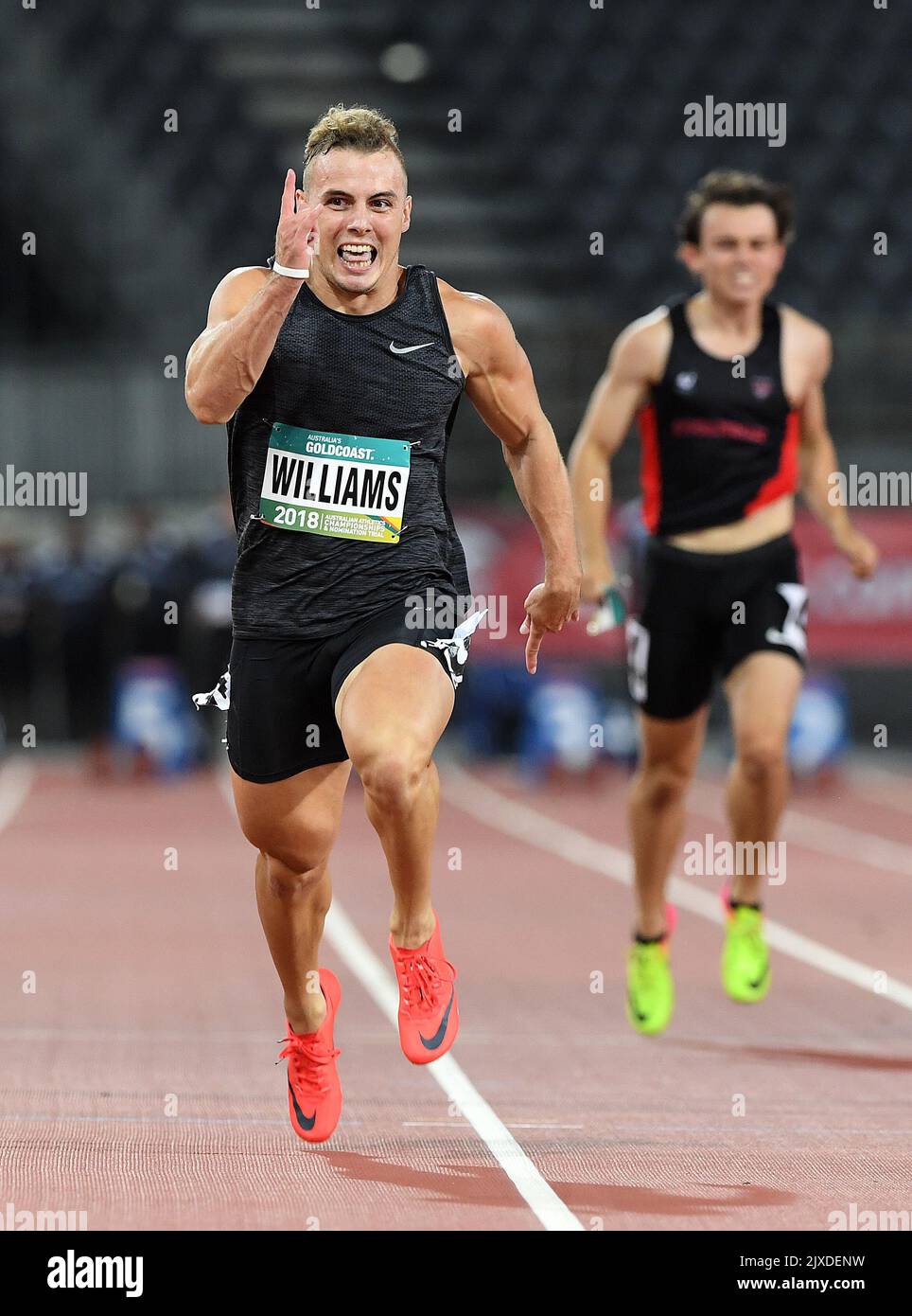 Trae Williams of Queensland crosses the line to win the Mens 100m Final ...