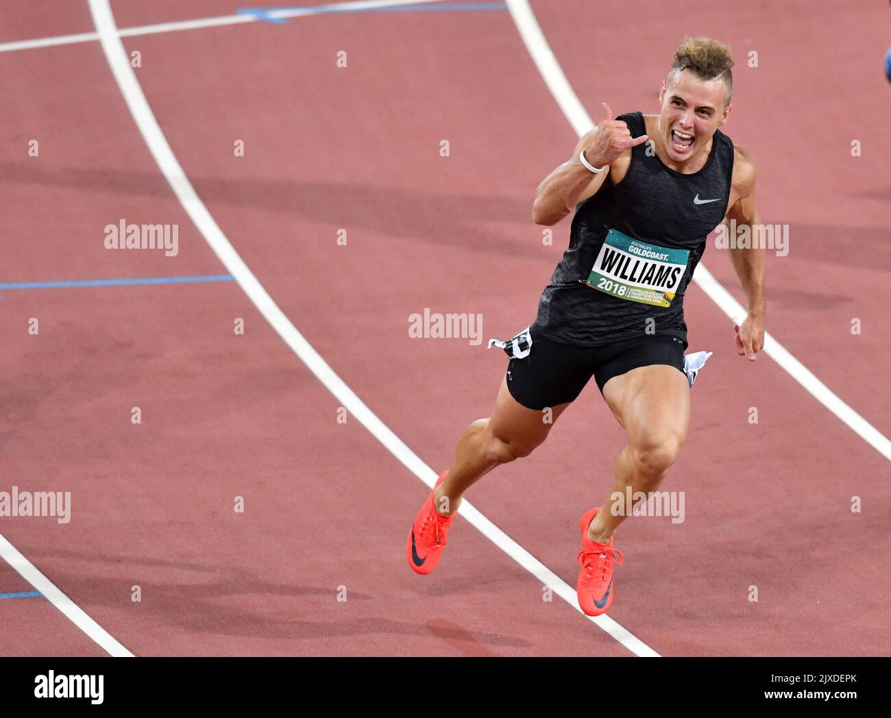 Trae Williams of Queensland celebrates after winning the mens 100 ...