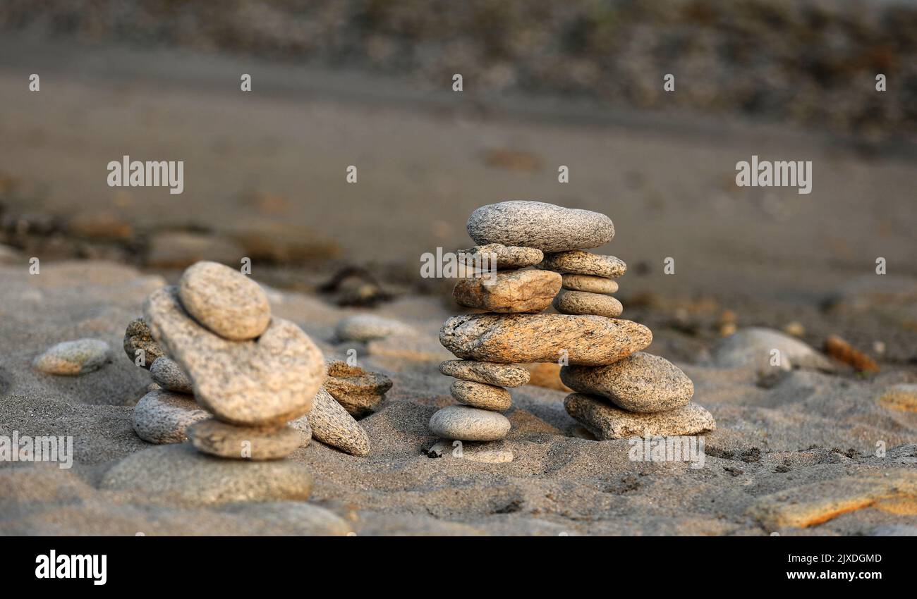 Stone male stones yoga meditation on the beach Stock Photo - Alamy