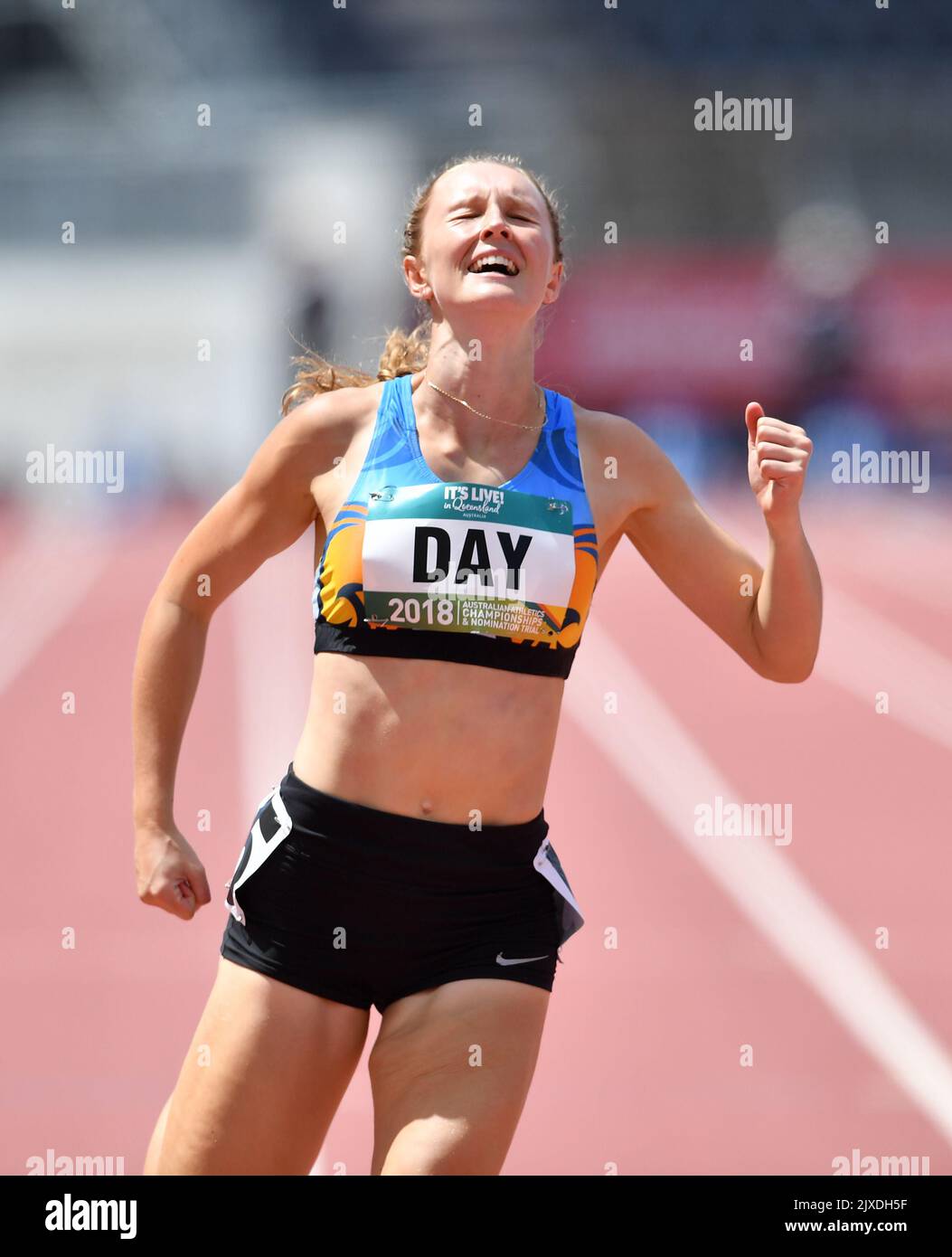 Riley Day of Queensland celebrates winning the womens 200 metres final ...