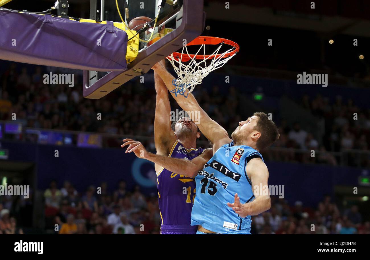 Todd Blanchfield (left) of the Kings shots under the pressure of Robert ...