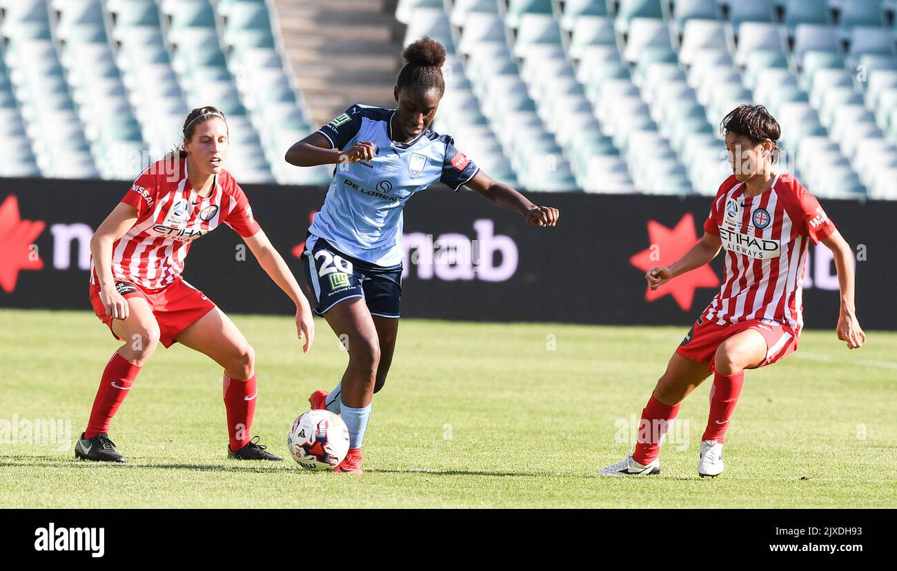 Princess Ibini-Isei ( centre)of Sydney competes for possession against ...