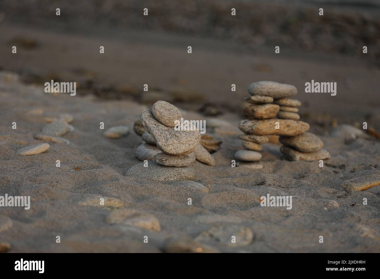Stone male stones yoga meditation on the beach Stock Photo - Alamy