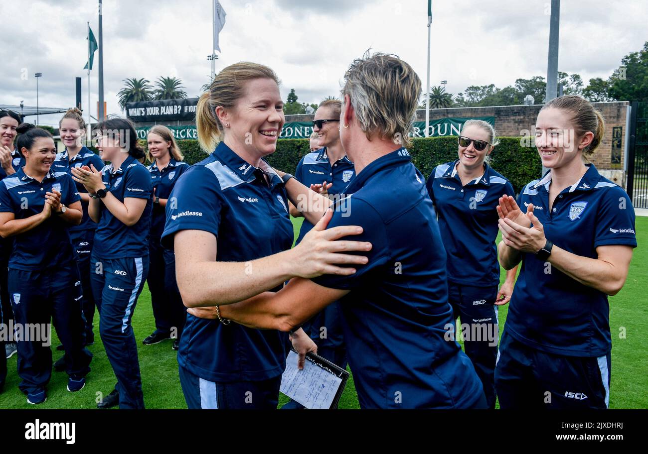 Cricketer Alex Blackwell (centre) is congratulated by team members ...