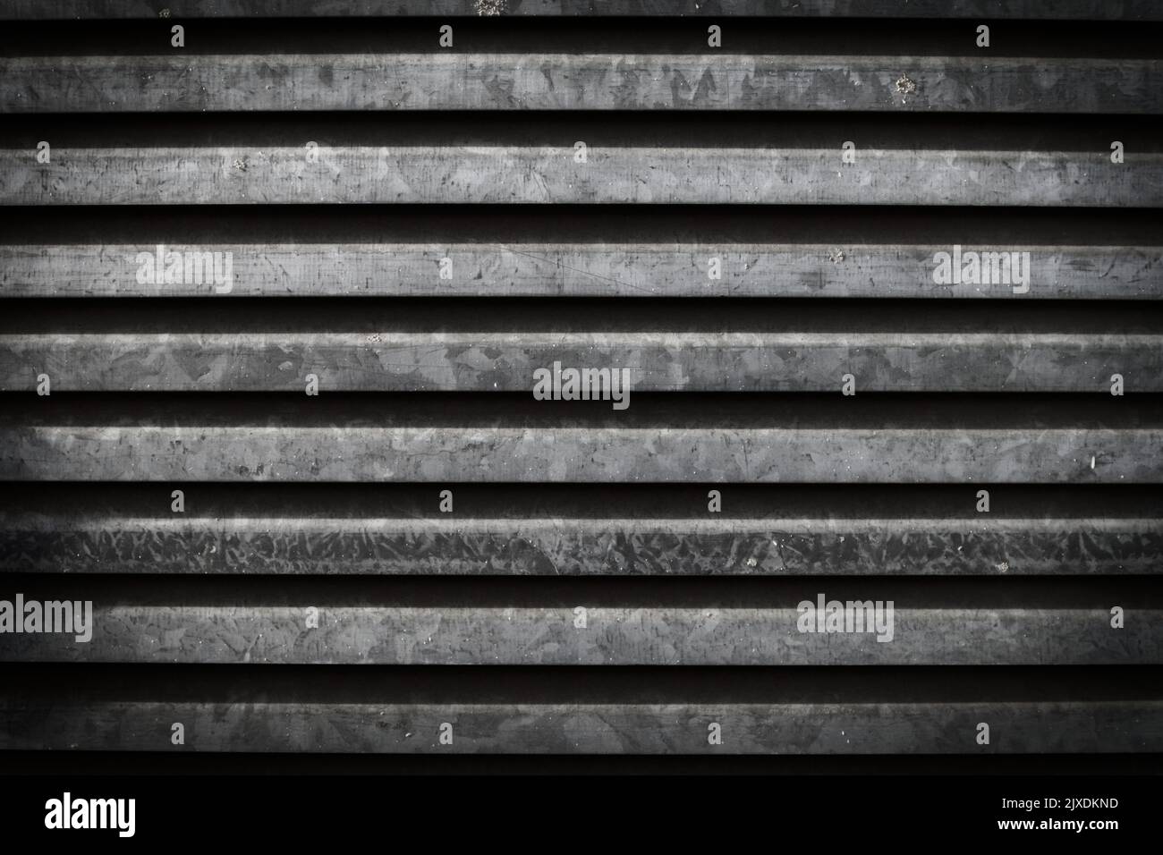 Close-up of a kind of metal shutter that offers a texture of horizontal ...