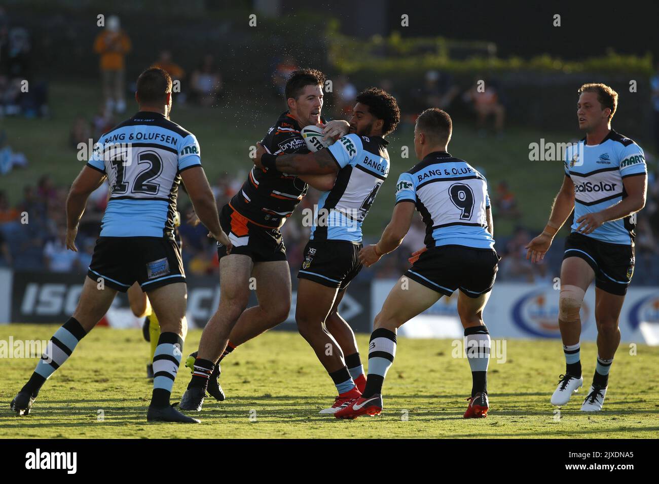Matt Eisenhuth of the Tigers (left) is tackled by Ricky Leutele of the ...