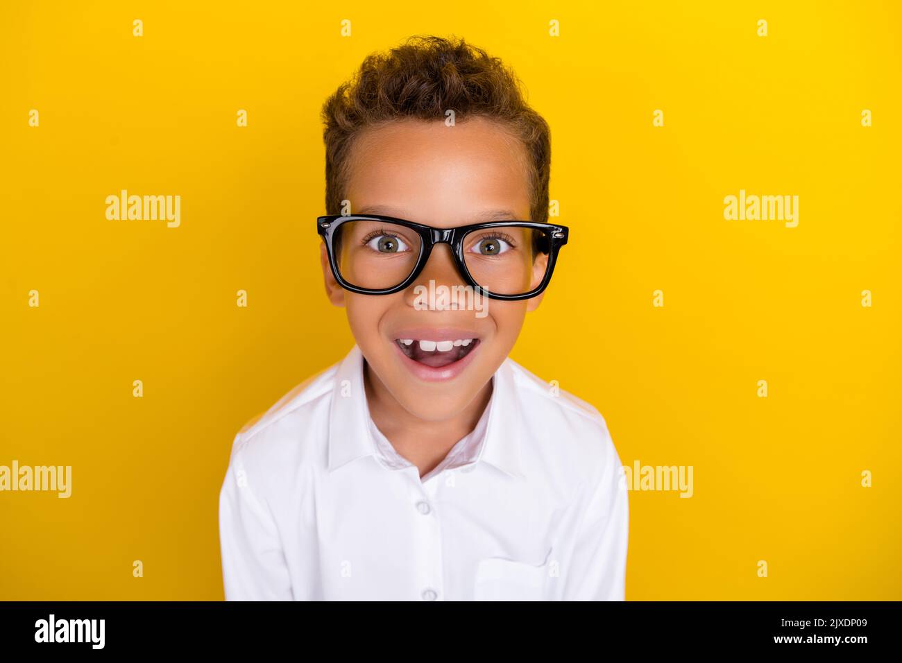 Close up photo of cheerful boy learner first time wear glasses enjoy ...