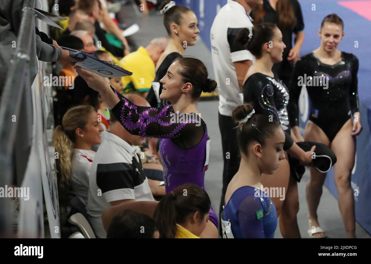 Alexandra Eade of Australia signs autographs after competing in the ...