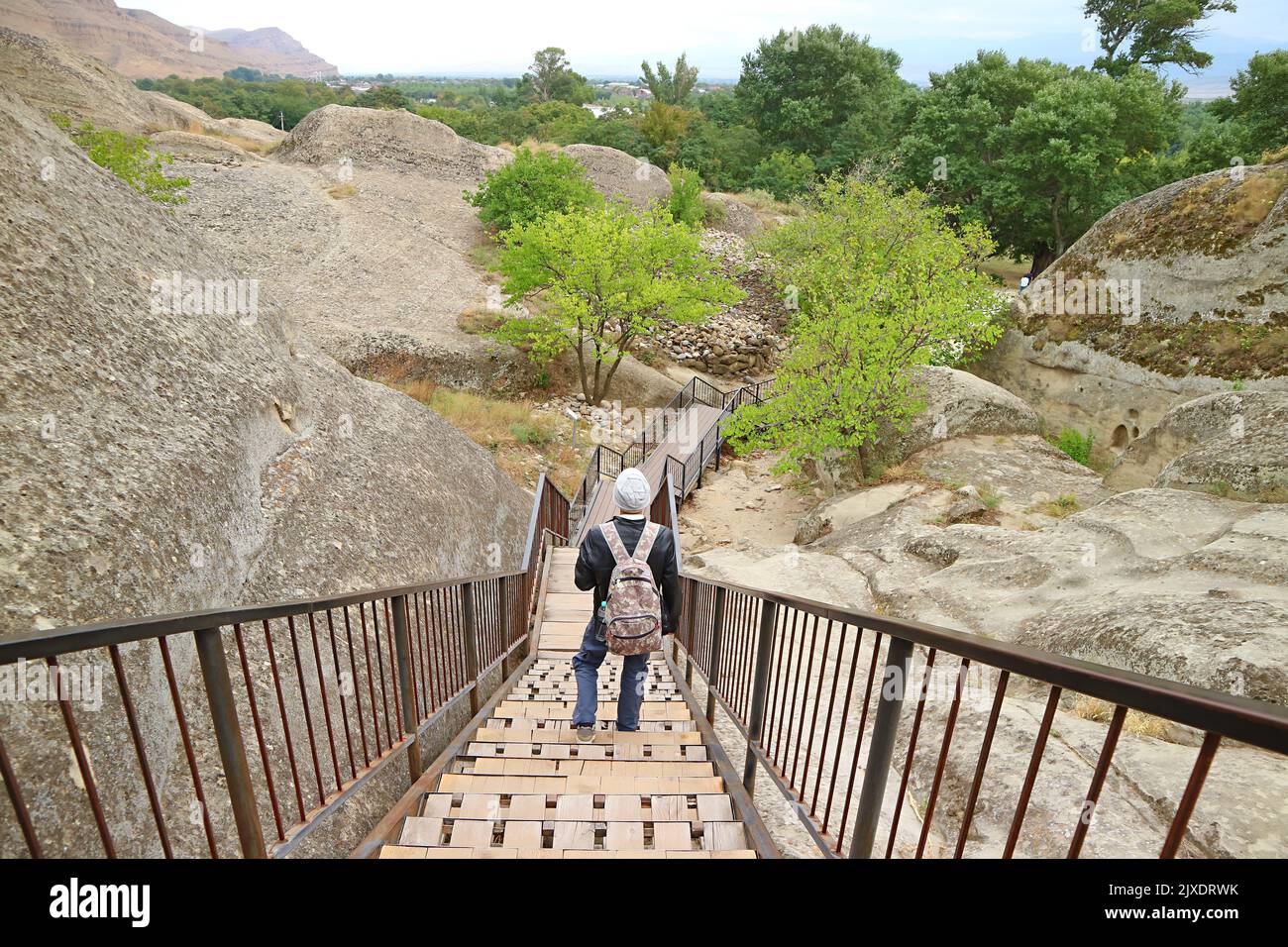 Visitor on the Staircase of Ancient Uplistsikhe Cave Town on the Rocky ...