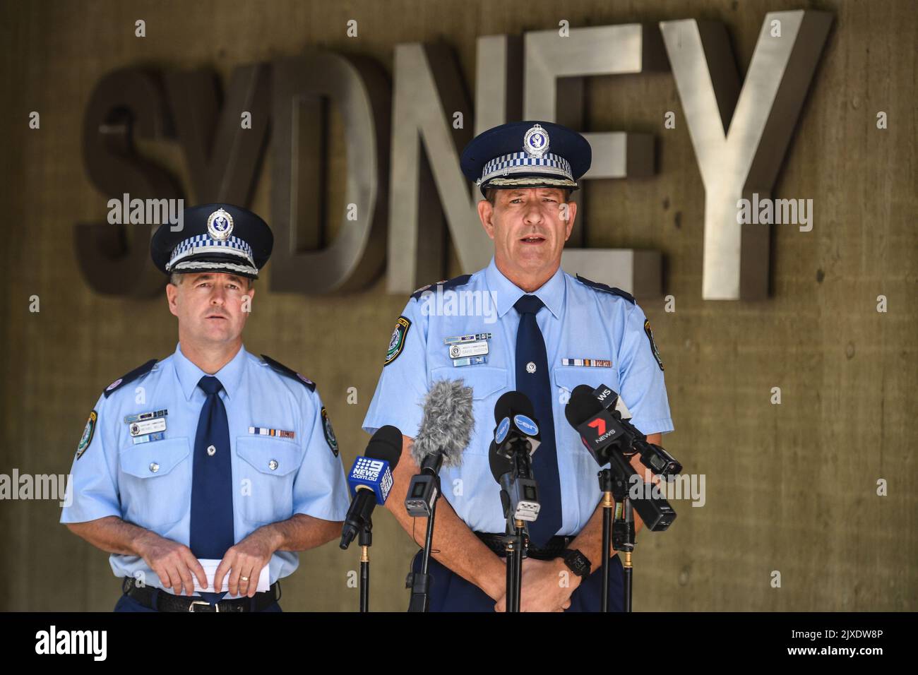 Deputy Commissioner Dave Hudson (right) speaks as Assistant ...