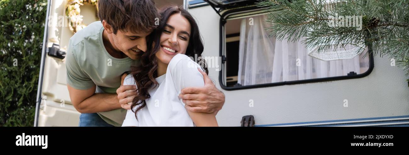 Couple hugging camper van hi-res stock photography and images - Alamy