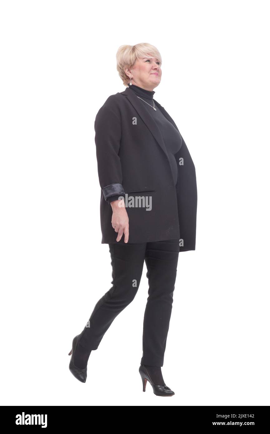 in full growth.confident business woman striding forward. isolated on a ...