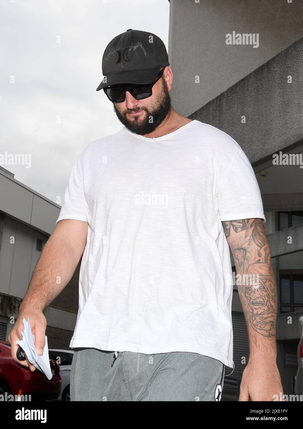 Ryan Hallifax (left) leaves the Logan District Watchhouse in Beenleigh ...