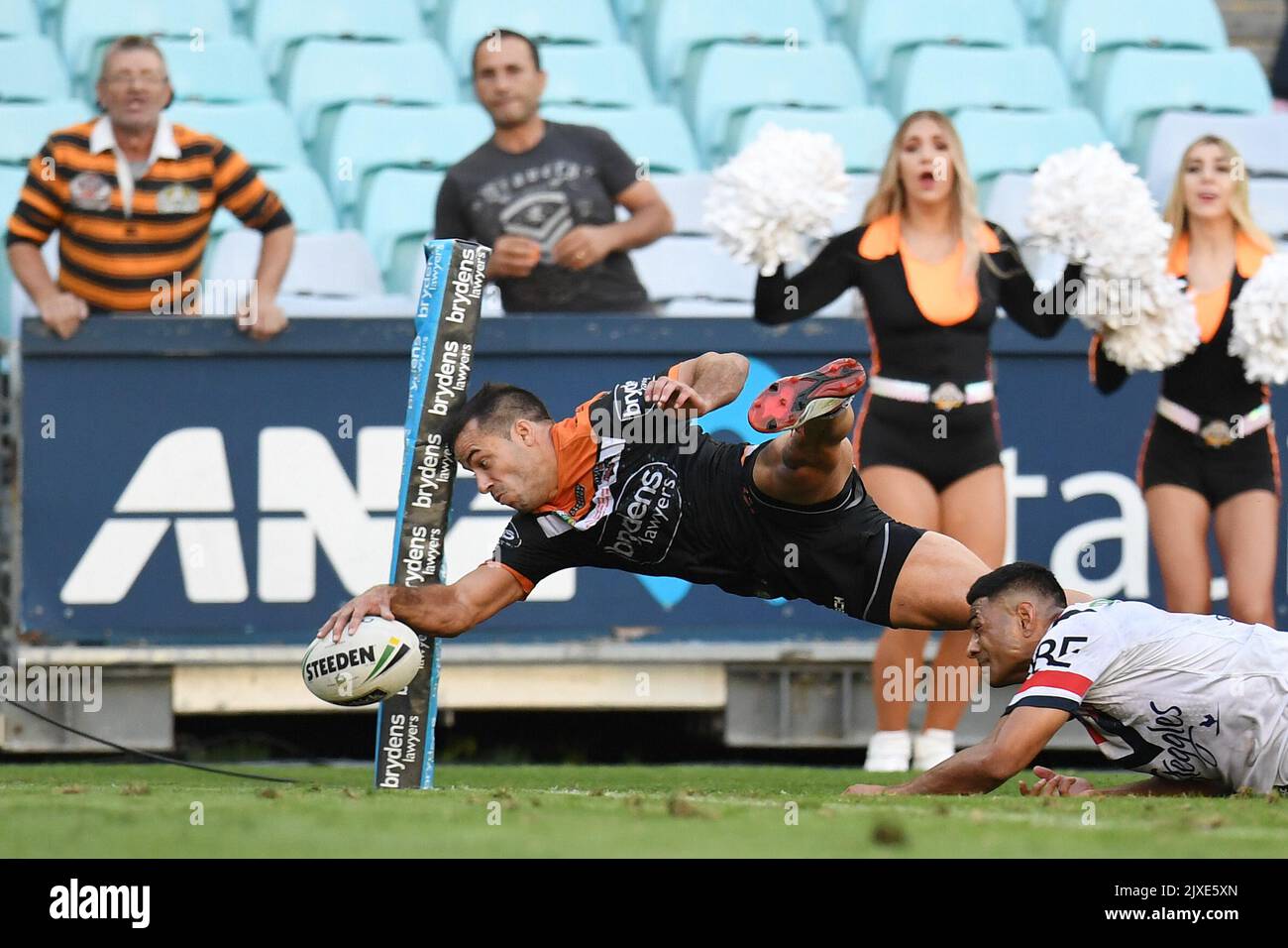 Corey Thompson of the Tigers scores the match winning try against the ...