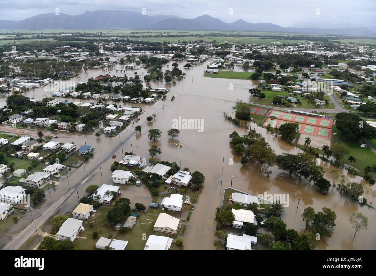 Houses are inundated with flood waters in Ingham in North Queensland ...