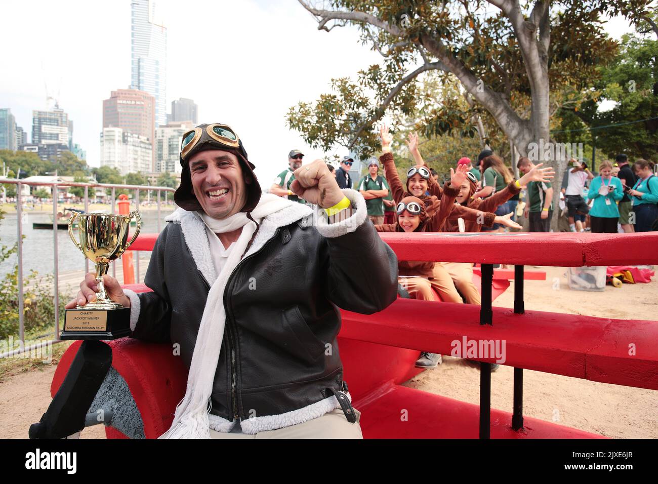 Daniel Mazzei, known as the Red Baron, poses with the trophy after his ...