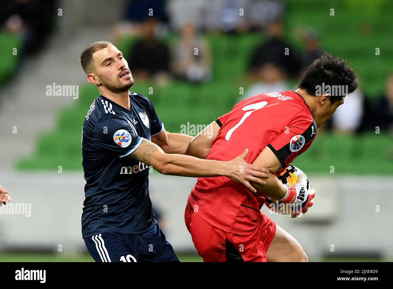 James Troisi of Victory collides with Jung Sungryong of Kawasaki ...