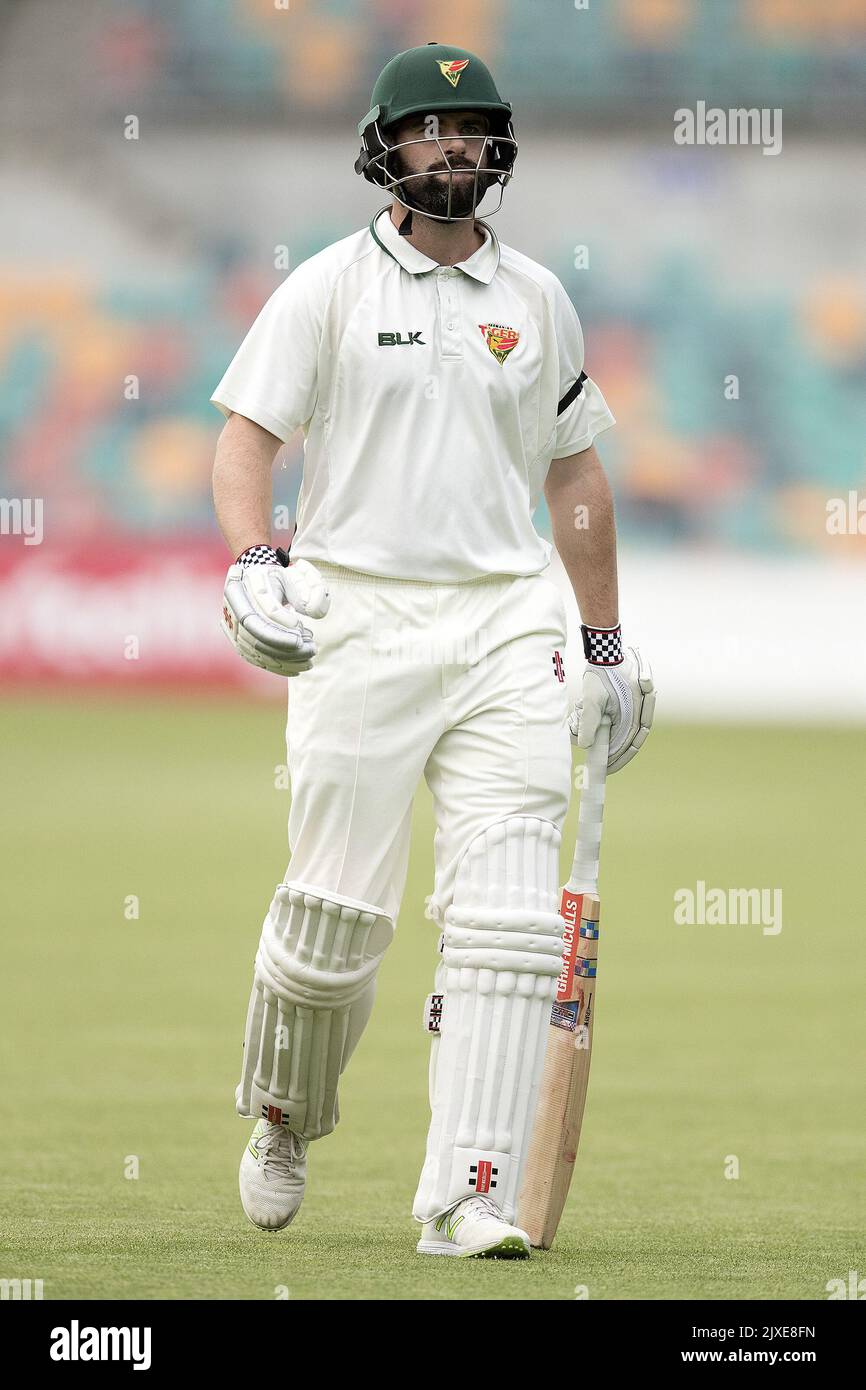 Alex Doolan of Tasmania leaves the field after being dismissed during ...