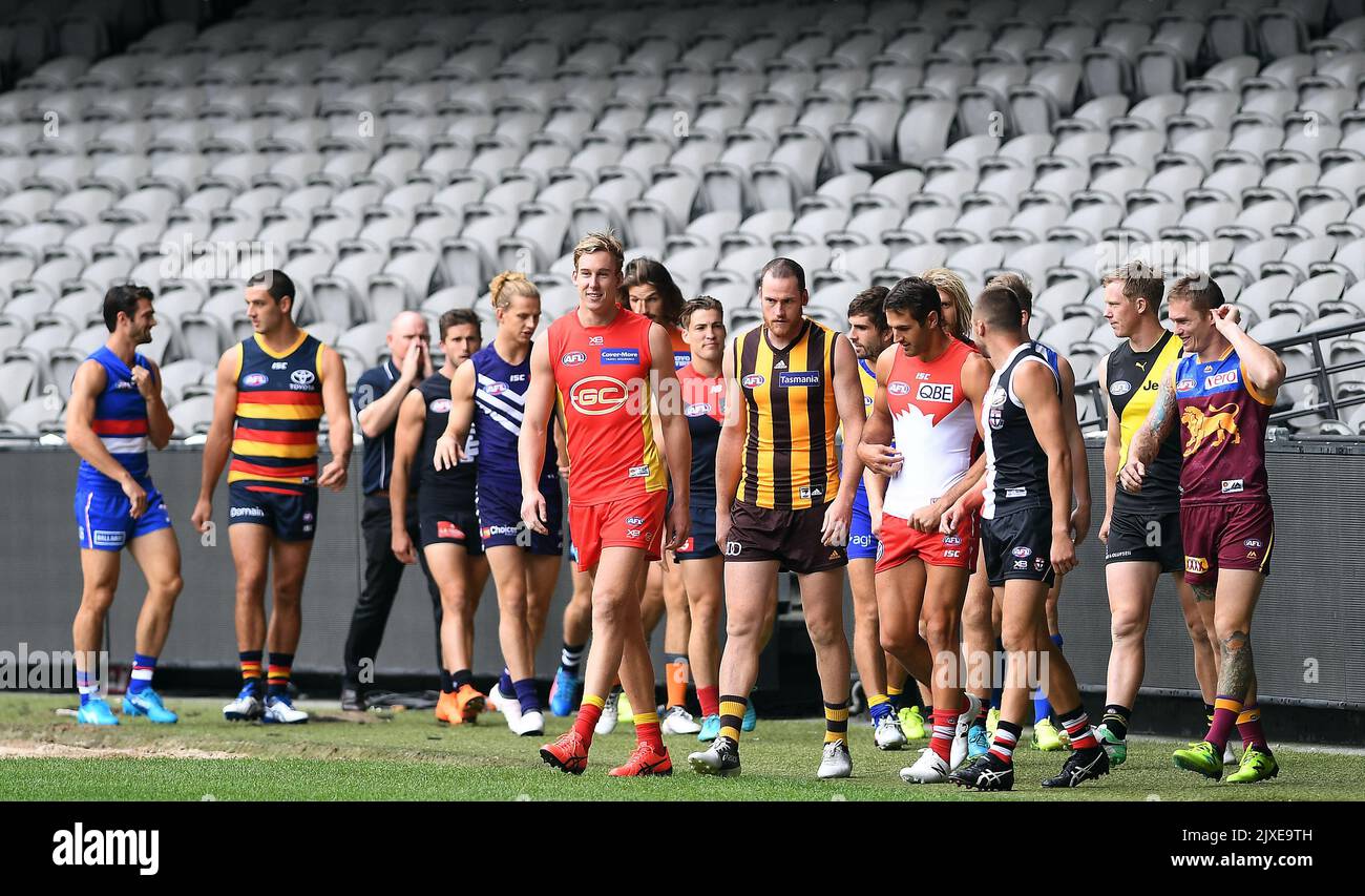 Suns co-captain Tom Lynch (sixth from left) leads the AFL club captains ...