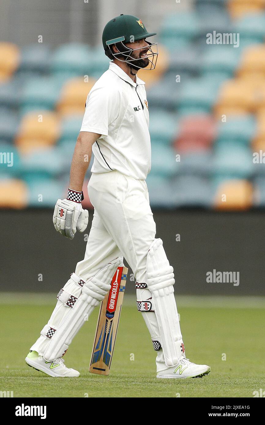 Alex Doolan of Tasmania leaves the field after being dismissed during ...